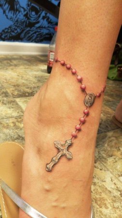Top 35 Stylish Small Cross Tattoo Designs for Men & Women